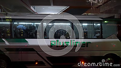 Plusliner Bus Arrive the Station. Passengers with Facemask Down the Bus ...