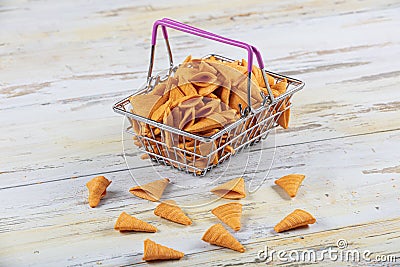 Portion Of Cone Shaped Snack Tornado Shaped Crackers. Yellow Spicy ...