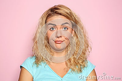 Portrait Of Mistrustful Young Woman On Color Background Royalty-Free ...