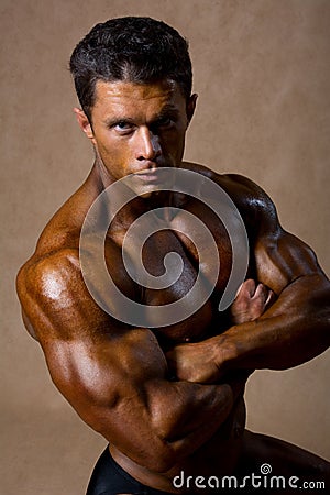 Portrait Of A Muscular Man Standing With Folded Hands Royalty-Free ...