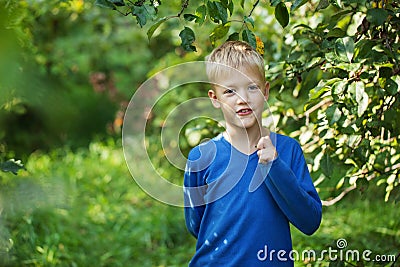 Portrait Smiling Boy On The Green Background, Outdoors Stock Photo ...