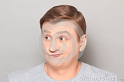 Portrait Of Thoughtful Puzzled Man With Funny Expression On Face Stock ...