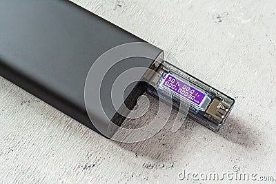 Powerbank, USB Multimeter Charger Detector On A Gray Background With ...