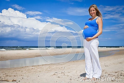 Pregnant woman at beach stock photo. Image of blue, love - 21305286