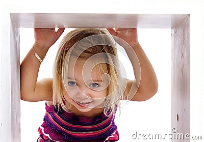 Pretty Young Girl Smiling Through A Box Stock Photo | CartoonDealer.com ...