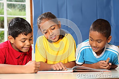 Primary School Kids Learning Together In Classroom Stock Photos - Image ...