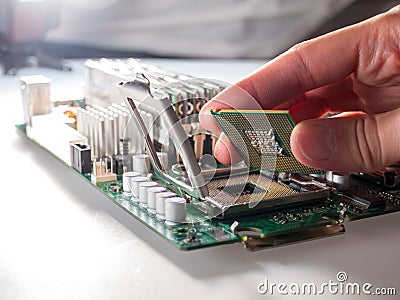 The Process Of Connecting The CPU To The Processor Socket On A Modern Computer Motherboard ...