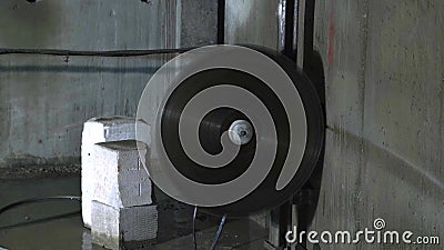 The Process of Cutting a Concrete Wall. the Round Disc Cuts Concrete ...