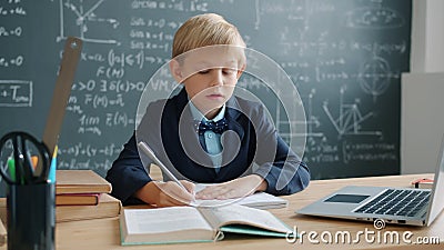 Prodigy Kid Taking Notes in University Classroom with Chalkboard in ...