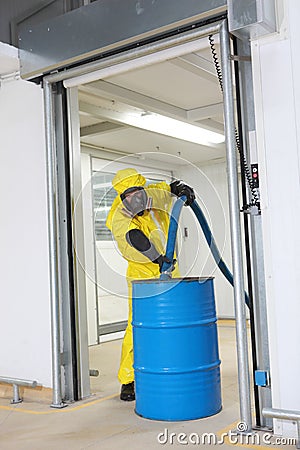 Technician Filling Large Silver Tank in Factory Stock Photo - Image of ...