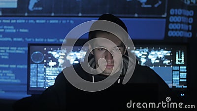 Geek Hacker Programmer is Working on Computer in Cyber Security Center Filled with Display ...