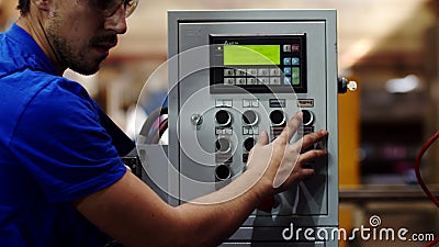 Professional Worker Watching Over Manufacturing Process on an Indoor ...