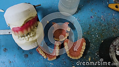 Prosthetic Laboratory Workplace with False Teeth in the Table Stock ...