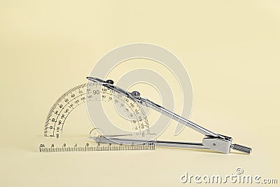 Protractor And Metal Compass On Yellow Background Royalty-Free Stock ...