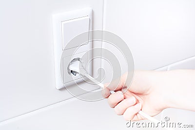 Pulling An Electrical Cable Out Of A Wall Socket To Save Energy Royalty ...