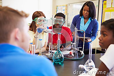 Pupils Carrying Out Experiment In Science Class Royalty-Free Stock ...