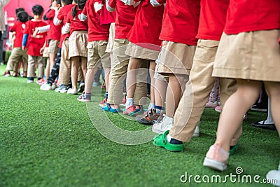 Queue Of Asian Kids In School Uniform Standing In Line Royalty-Free ...