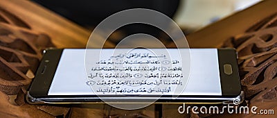 Quran in Smart Phone Apps on Wooden Book Stand Editorial Stock Image ...