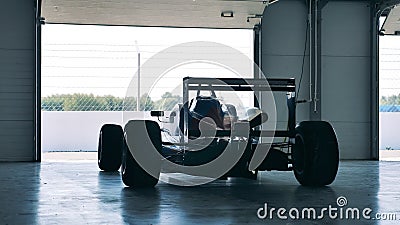 Racing Car in a Garage Unit with Nobody Inside Stock Video - Video of ...