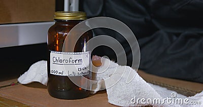 A Rag Falls on the Surface Next To a Jar of Chloroform, Close Up ...