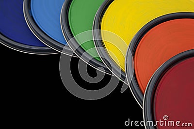 Rainbow Colored Paint Can Lids Against Black Background Royalty-Free ...