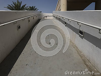 Ramp Construction With Plain With Wall Mounted Hand Rails Both Sides ...