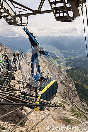 Gondola With Tourists In The Upper Station Of The Dachstein Cable Car ...