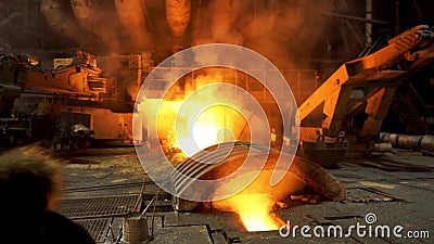 Rear View of a Worker in Fireproof Uniform and an Engineer Standing in ...