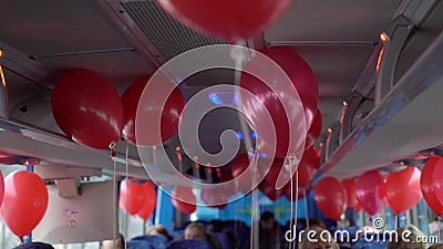 Red balloons in a bus stock footage. Video of sunny - 113112200