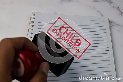 Red Handle Rubber Stamper And Child Exploitation Text On White ...