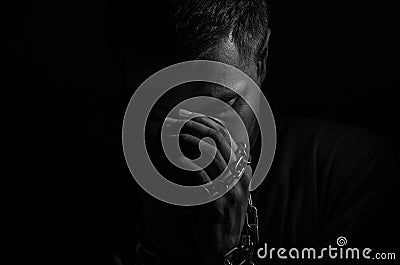 Repented Man Prisoner With His Hands Shackled In Chains On A Dark ...