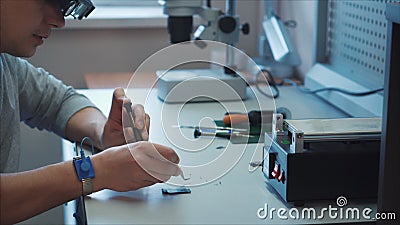 Research Laboratory, Robotics Engineer Checks the Operation of the ...