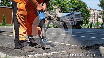 Road Worker Breaking Street Asphalt with Jackhammer. Stock Footage ...