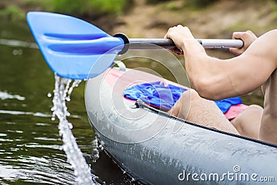 A Rower In A Boat With An Oar. A Man Rafts On A Kayak On The River ...