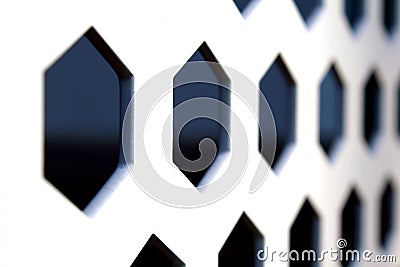 Rows Of Hexagonal Shaped Holes On A White Metal Board Royalty-Free ...