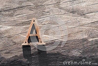 Rusty Letter A Sign Lying On A Wood Texture In Warm Light Stock Image ...