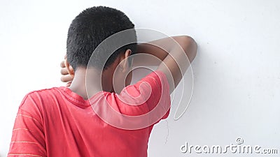 Sad child hiding his face stock video. Video of worry - 260606945