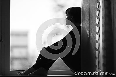 Sad Girl On Windowsill Looking Out The Window Stock Photography ...