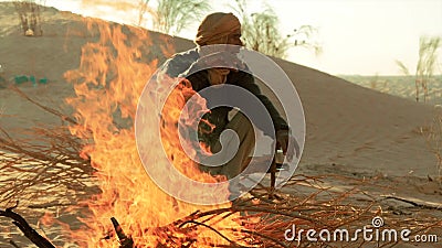 Sahara man near a fire stock footage. Video of landscape - 62954138