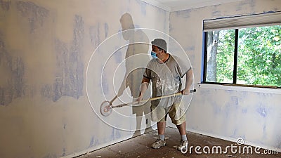 Sanding is Being Done by a Worker Using a Sand Trowel while Renovating ...