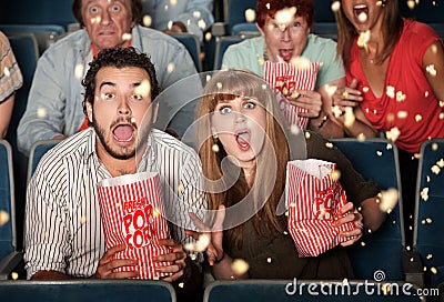 Scared People Tossing Popcorn Royalty Free Stock Image - Image: 24252606