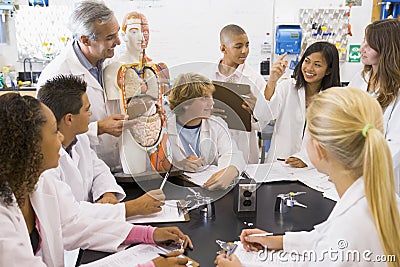 School Children And Their Teacher In Science Class Royalty Free Stock ...