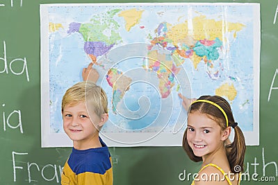 School Kids Pointing At Map In Classroom Royalty-Free Stock Image ...