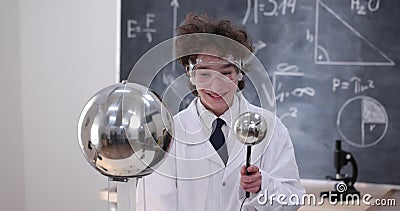 Schoolboy Experimenting in Physics Class. Young Student Doing Physics ...