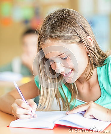 Young Girl Writing at School Stock Image - Image of background ...