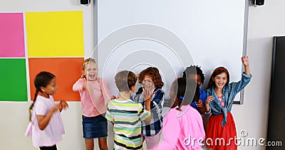 Schoolteacher and Kids Giving High Five in Classroom Stock Footage ...