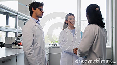 Scientists Shaking Hands in Laboratory Stock Video - Video of ...