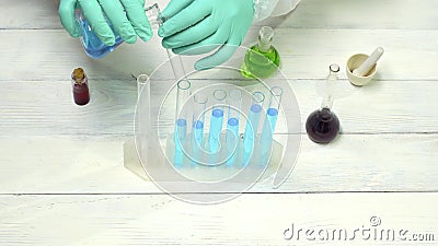 Scientist Dropping the Reagent into Test Tube for Reaction Testing in ...