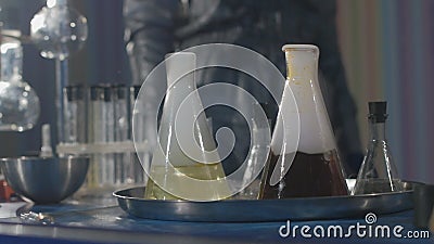 The Scientist and His Assistant Conduct Chemical Experiments in an ...
