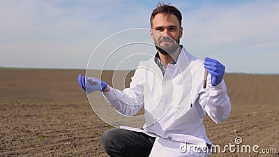 Scientist Studying Sample of Soil in Field Stock Video - Video of ...